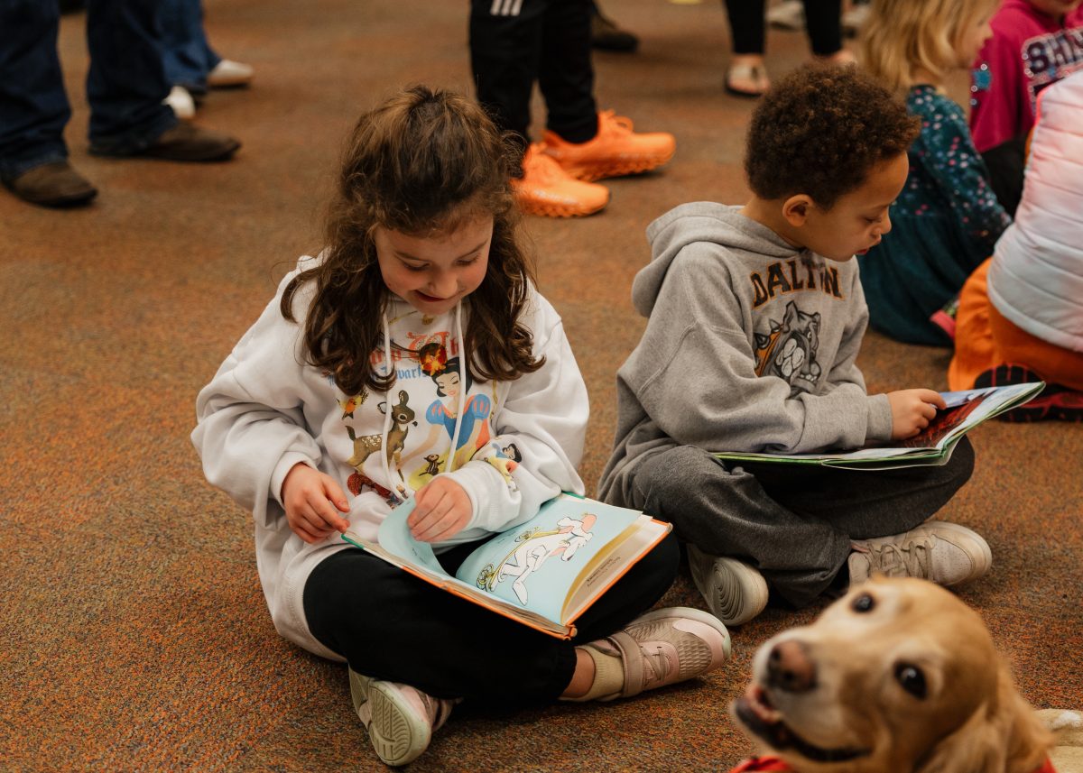 PAWS TO READ: Family literacy event draws readers of all ages – The ...